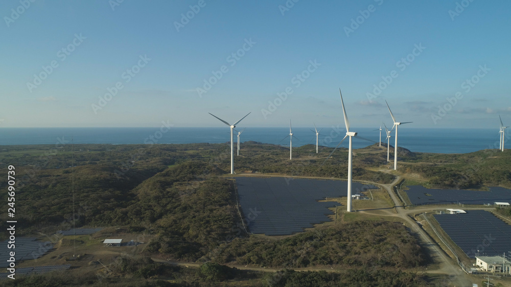 Aerial view of Windmills for electric power production on the seashore ...