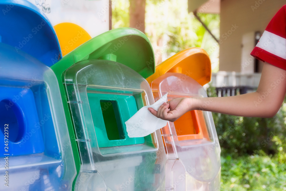 Put trash in trash by the classification of garbage. environmental safe ...