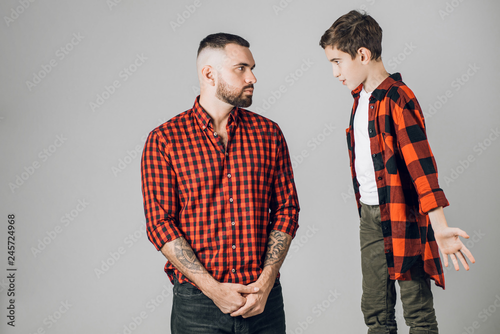 generation gap. little boy is scolding his daddy. disobedient child ...