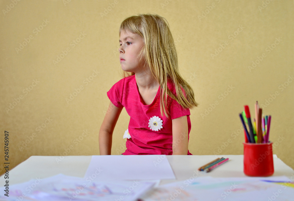 Little girl draws Beautiful little girl drawing lesson. The child draws ...