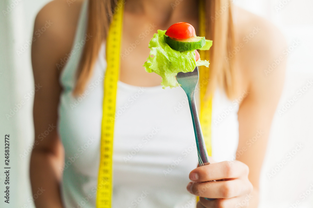 Dieting concept, beautiful young woman choosing between healthy food ...