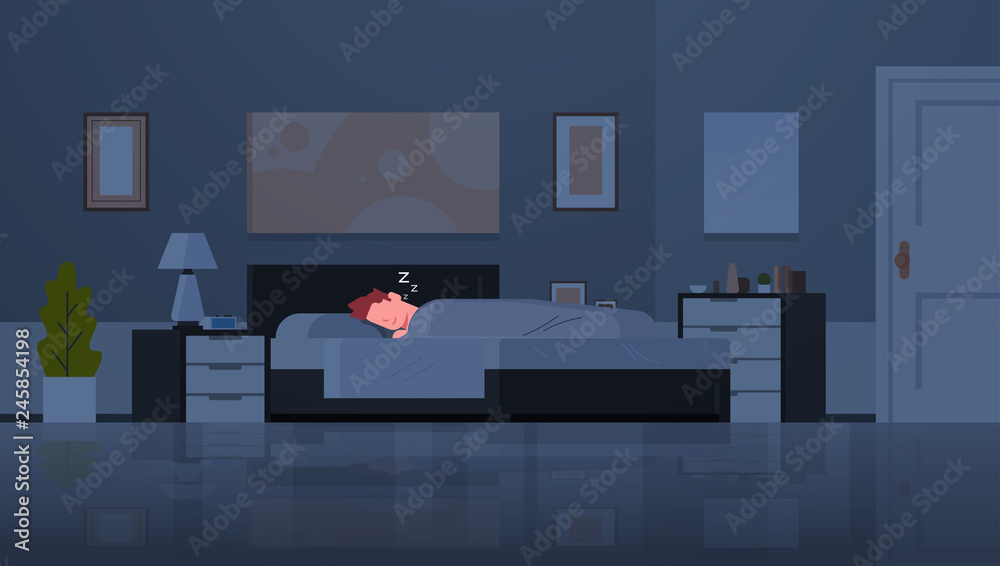 man sleeping in bed covered with quilt tired guy sleep at night dark ...