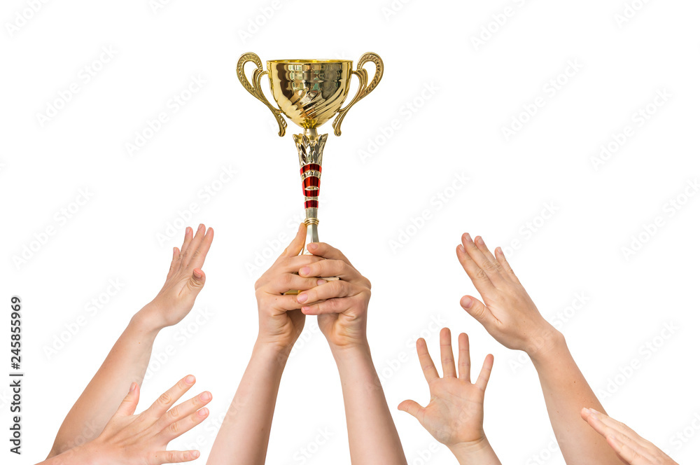 Winner is holding trophy in hands - many hands raised up Stock Photo ...