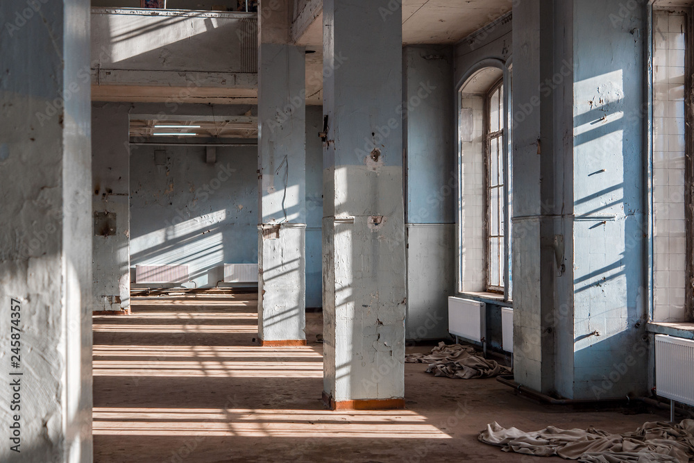 Old abandoned building of the Soviet manufactory. Empty room with ...