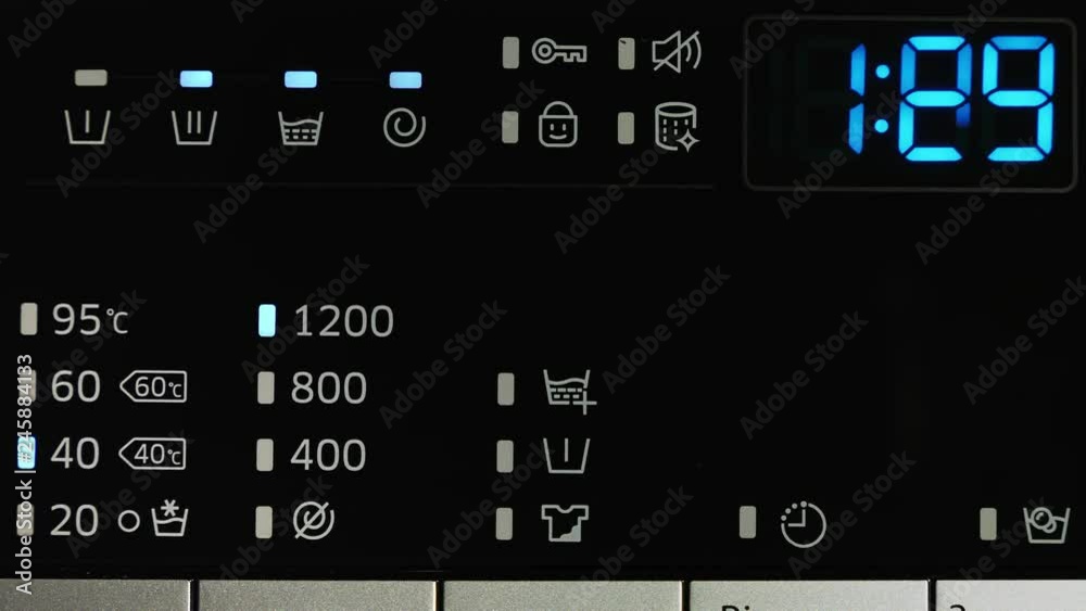 Modern digital control panel of the washing machine. Close-up shot ...