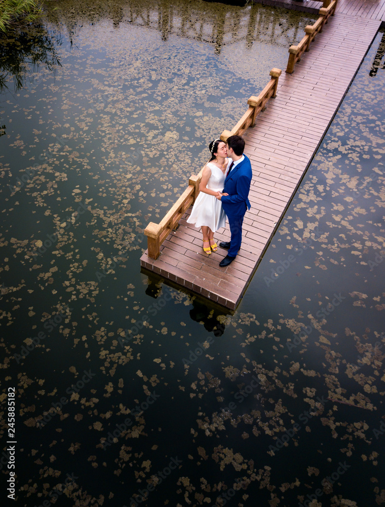 Romantic couple kissing in the park Stock Photo | Adobe Stock
