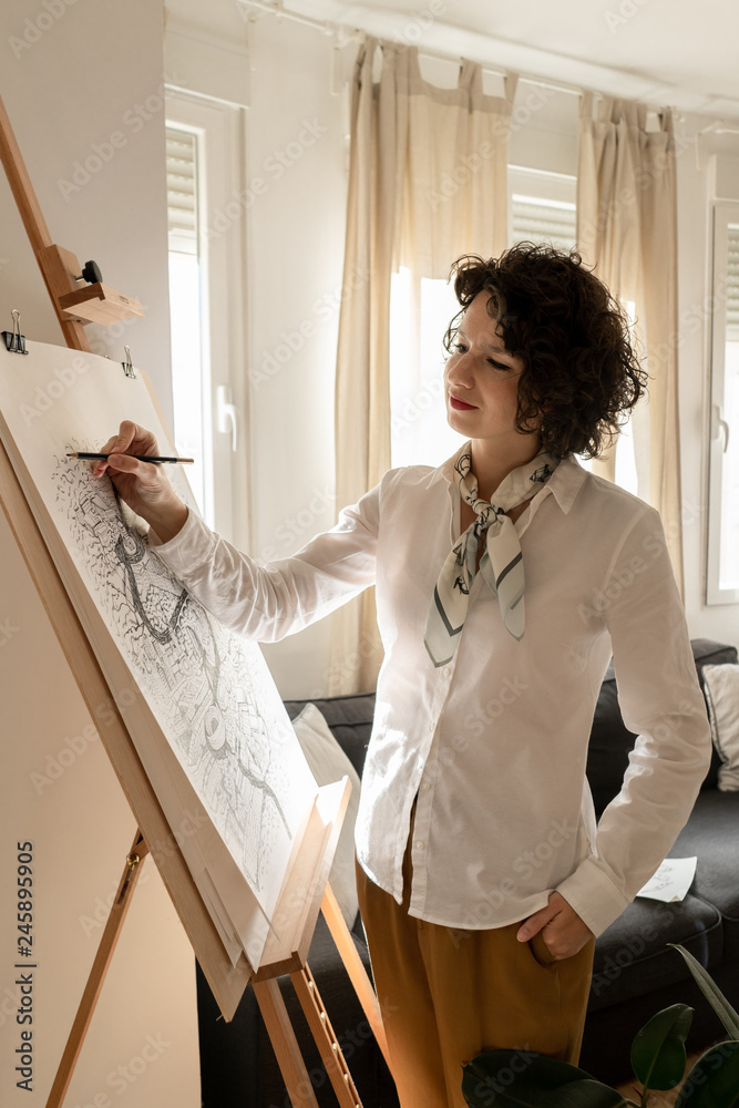 Person drawing city on canvas Stock Photo | Adobe Stock