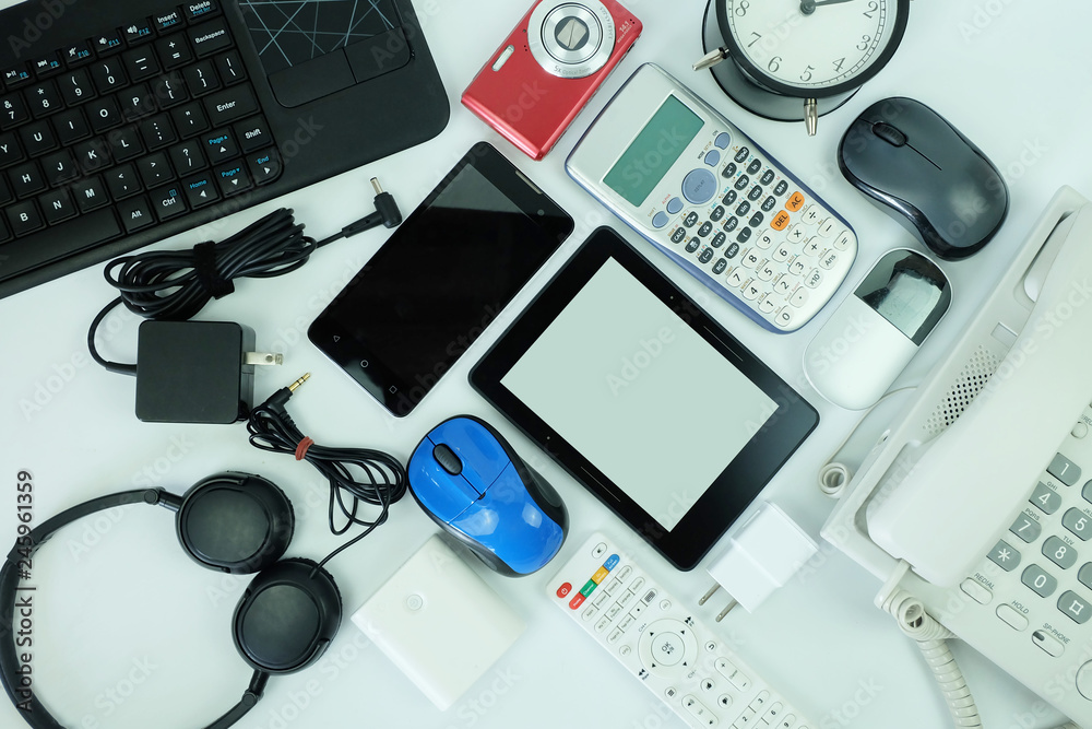 Used modern Electronic gadgets for daily use on White floor, Reuse and ...