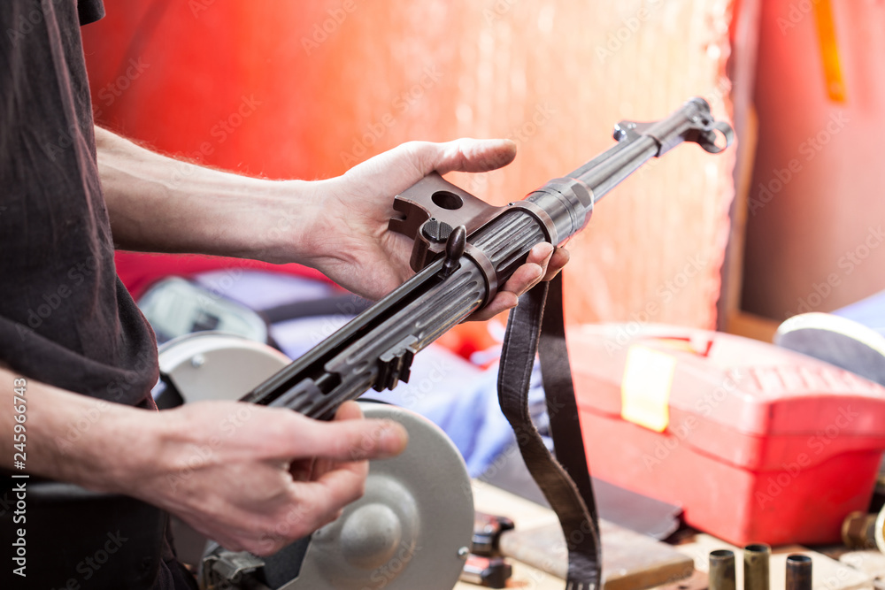 submachine gun MP-38 in the hands of a master Stock Photo | Adobe Stock