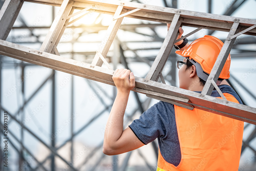 Young Asian maintenance worker man with orange safety helmet and vest ...
