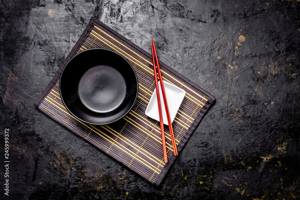 Empty Japanese dishes. A black ceramic bowl for Chinese noodles or Thai ...