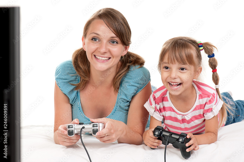 Mom and Daughter holding Joysticks and Playing Video Games on console ...