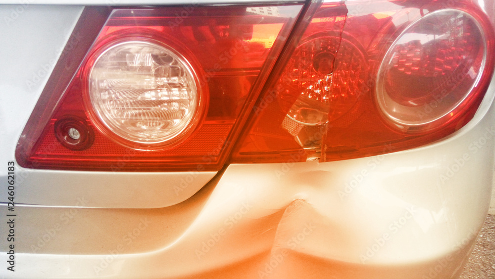 Damaged dented car rear bumper and broken tail light after crash ...