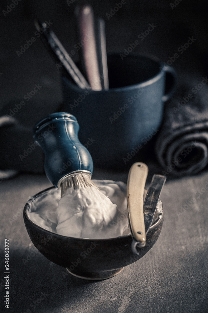 Barber equipment with old razor, soap and brush Photos | Adobe Stock