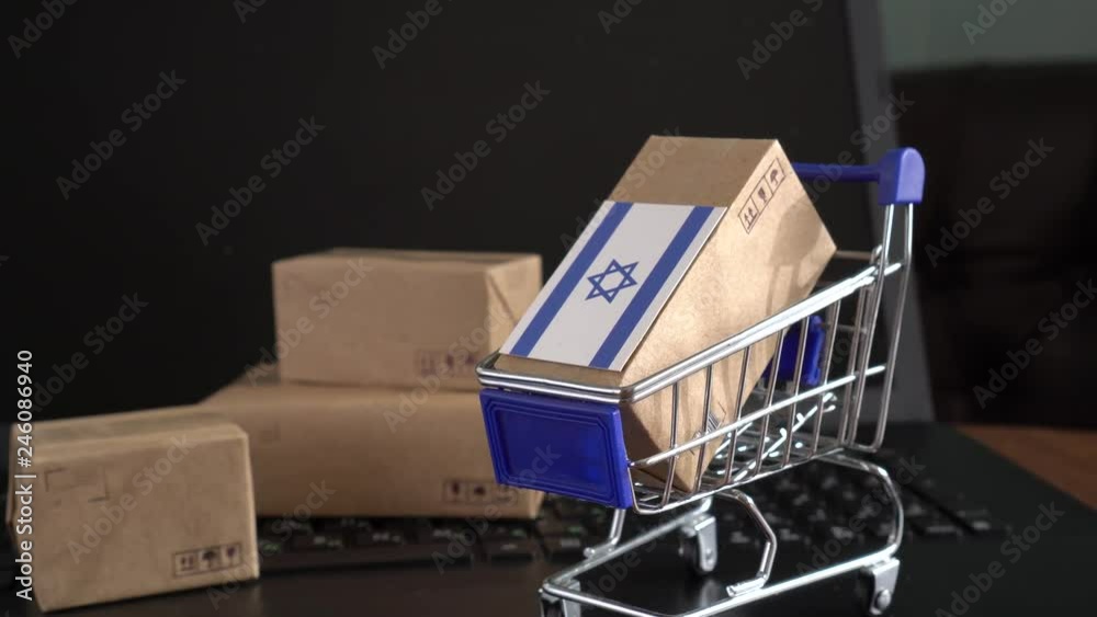 Parcel Boxes with a flag of Israel in a shopping cart on a laptop ...