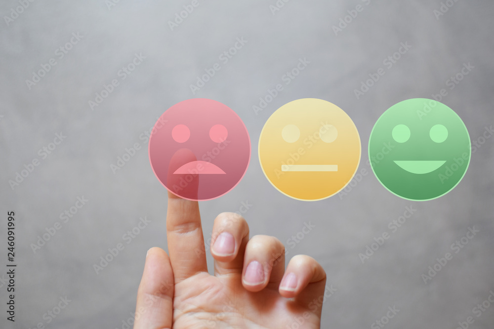 Finger rating with sad neutral happy face icons by pressing red button ...
