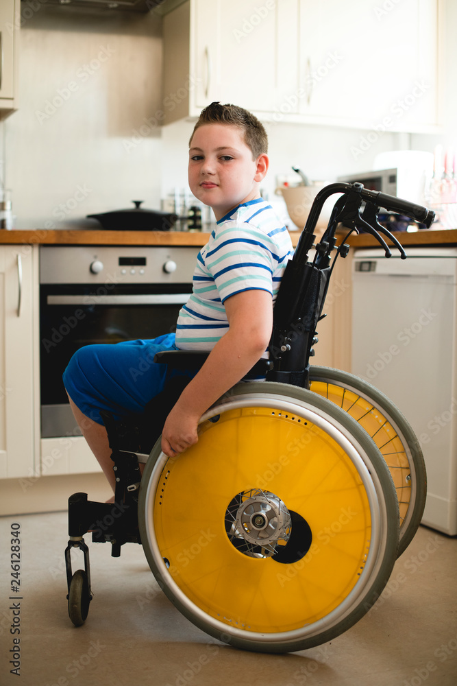 Young boy in a wheelchair Stock Photo | Adobe Stock