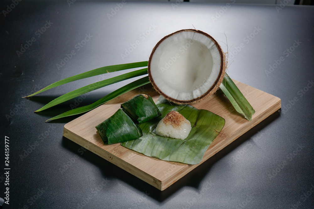 Pulut Inti. Savory glutinous rice with sweetened grated coconut wrapped ...