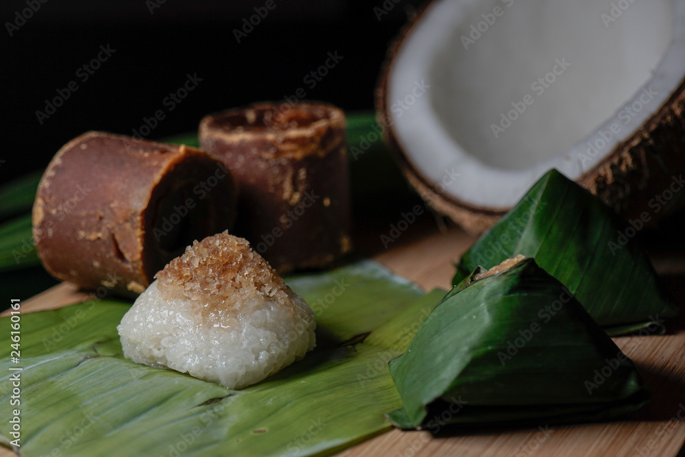 Pulut Inti. Savory glutinous rice with sweetened grated coconut wrapped ...