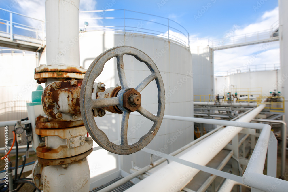 Oil and gas refinery - petroleum plant - pipe valve and oil tanks Stock ...