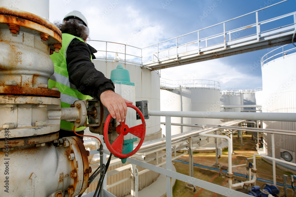 Oil and gas refinery - petroleum plant - pipe valve and oil tanks Stock ...