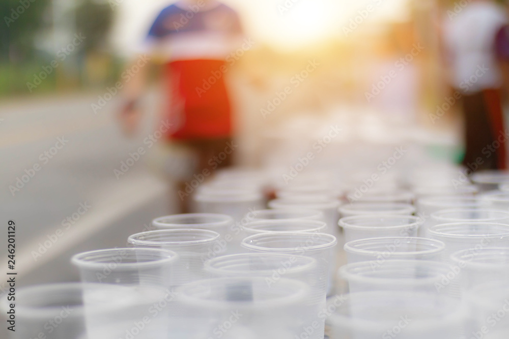 Runner take a water in a marathon race with sunrise Stock Photo | Adobe ...
