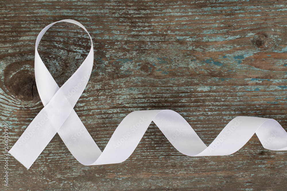 white ribbon. White or light pearl color ribbon for raising awareness ...