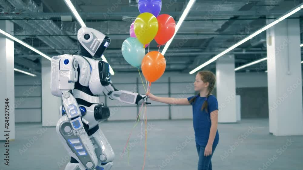 Massive cyborg is giving balloons to a girl and touching her hand Stock ...