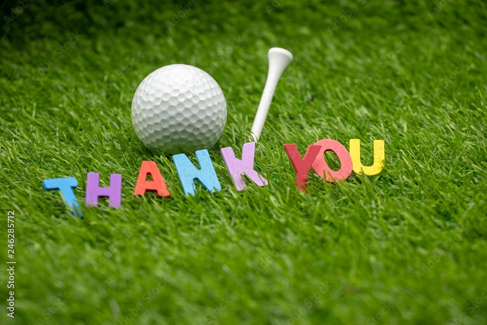 Golf ball with thank you word on green grass Stock Photo | Adobe Stock