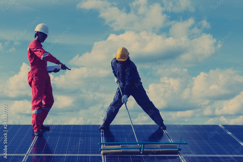 engineers operating and check generating power of solar power plant on ...