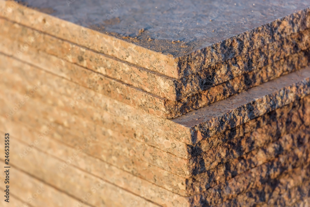 Facing plates from granite. Building. The texture of the stone. Solid ...