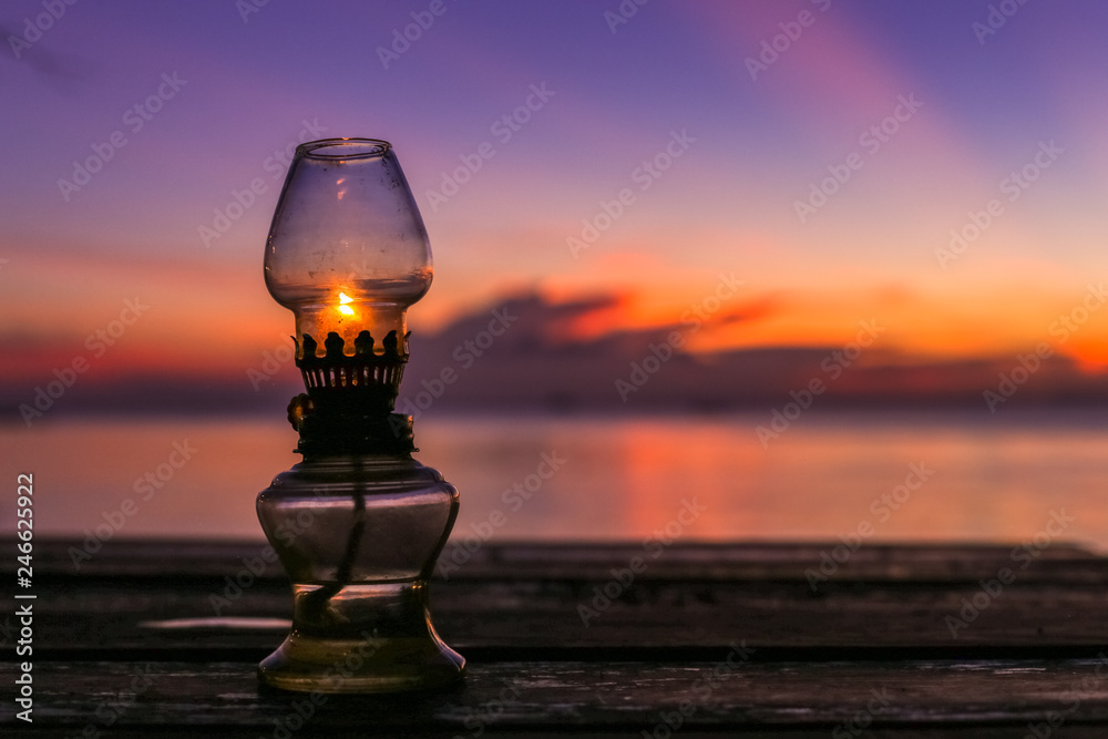 Beautiful old rustic oriental oil lamp silhouette in a beautiful ...