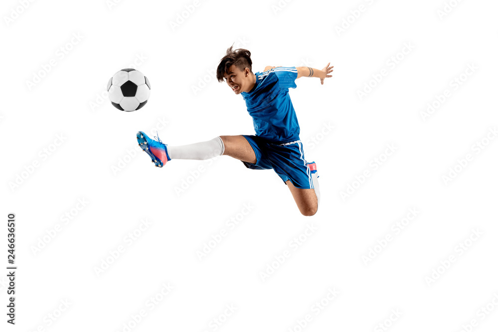 Young boy with soccer ball doing flying kick, isolated on white ...