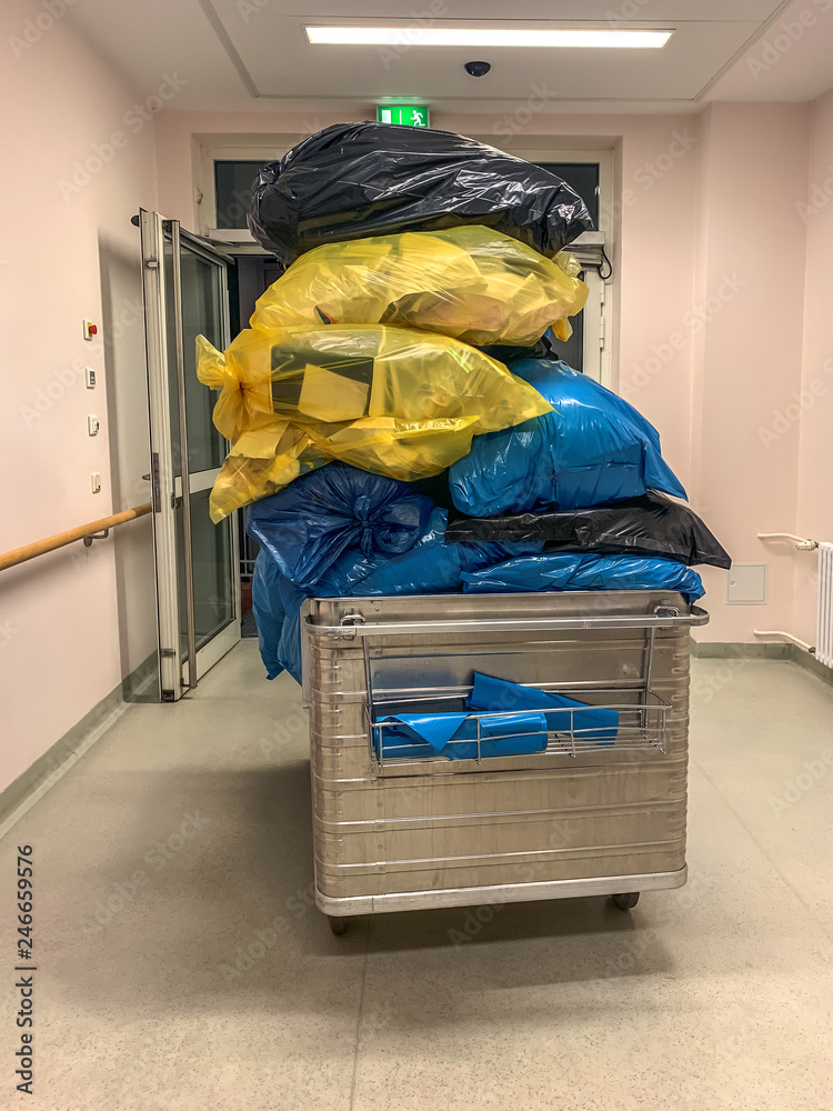 In a hospital there is a transport container with a lot of clinical ...