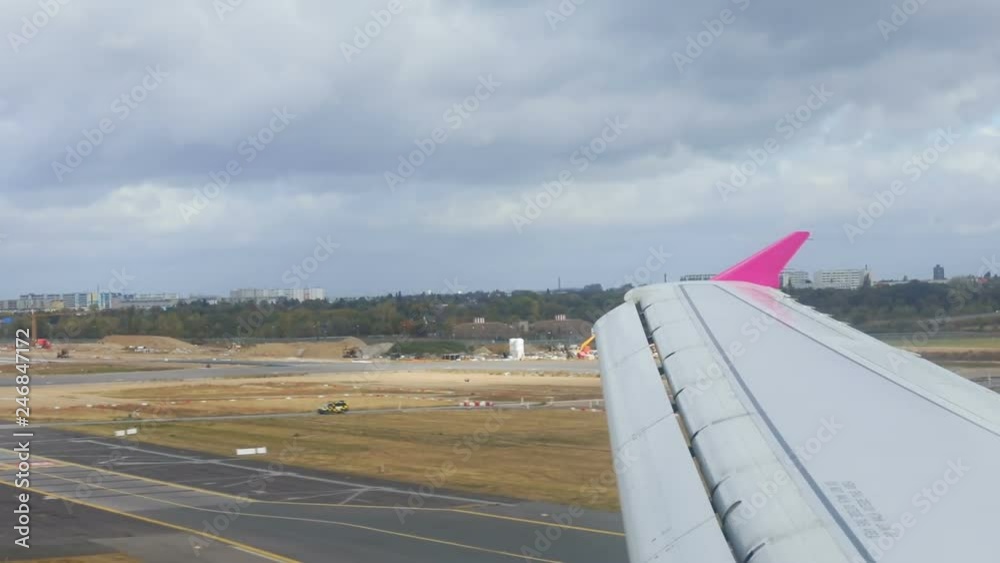 Side of airplane wing before take off. View from plane window. Cabine ...