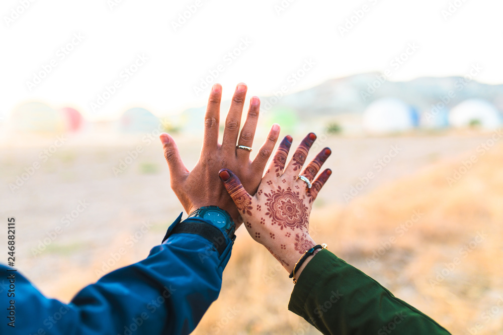 Hands up on forward. Young and happy couple holding hands. Man or boy ...