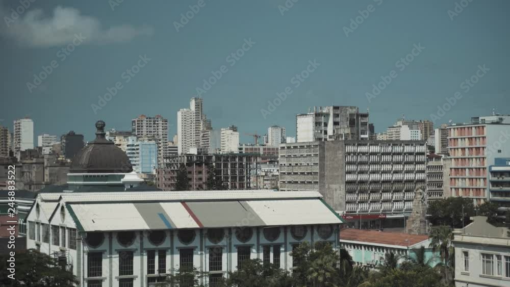 Static shot of old run down buildings/skyline in the heart of Maputo ...