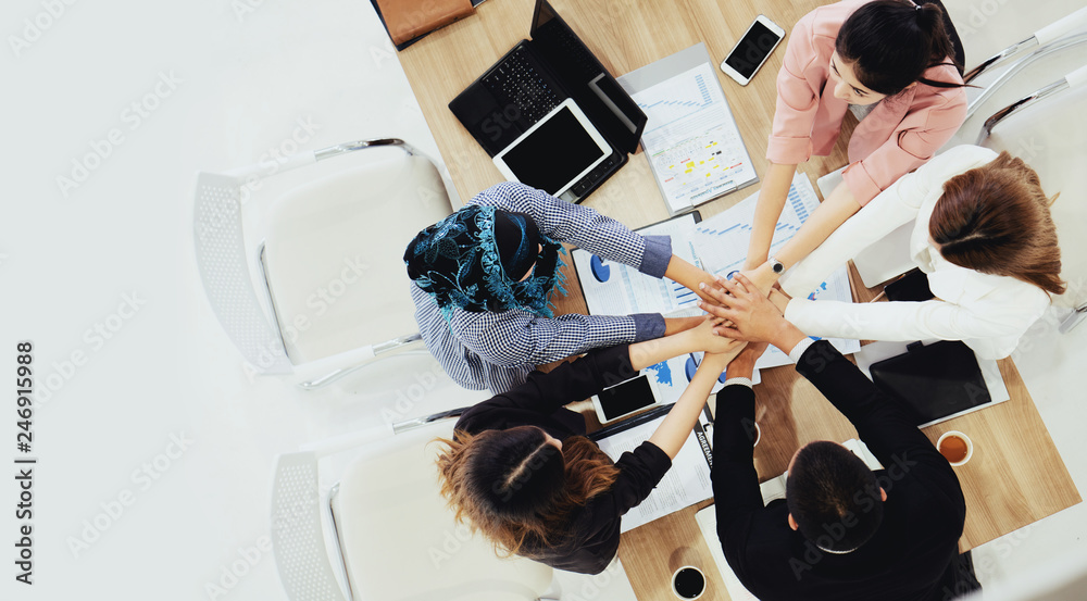 Various ethnicity Many business people join hands demonstrate harmony ...