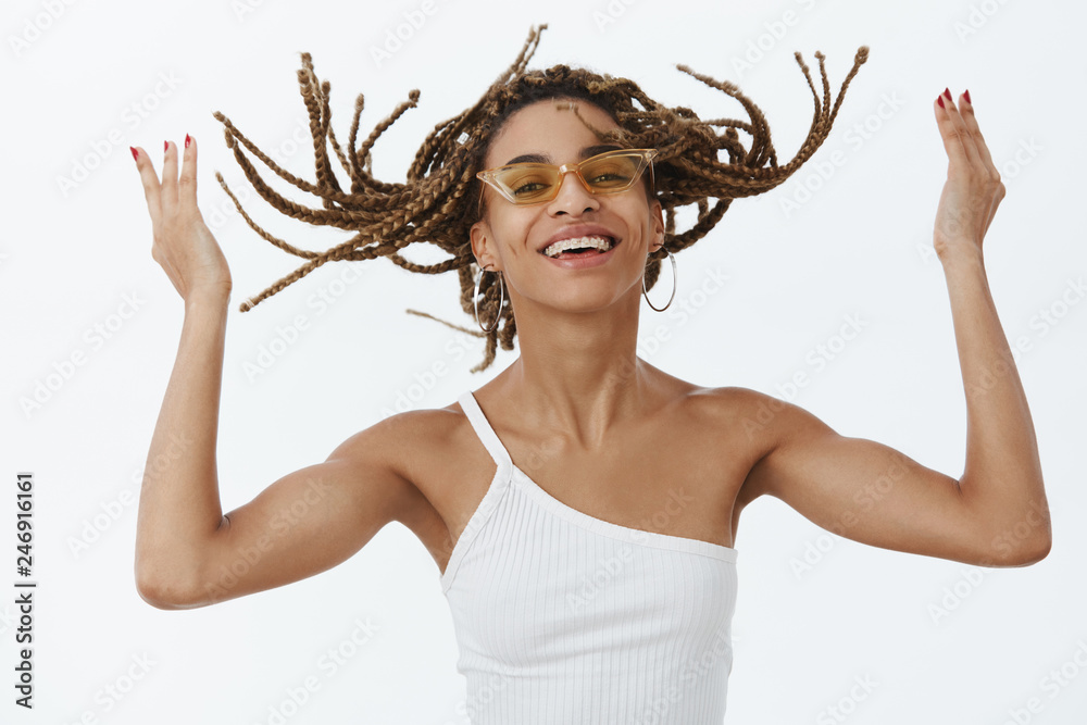 Girl enjoying cool new hairstyle being ready to party rock. Portrait of ...