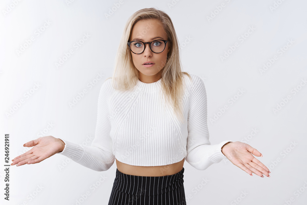Confused clueless worried female assistant in glasses cropped sweater ...