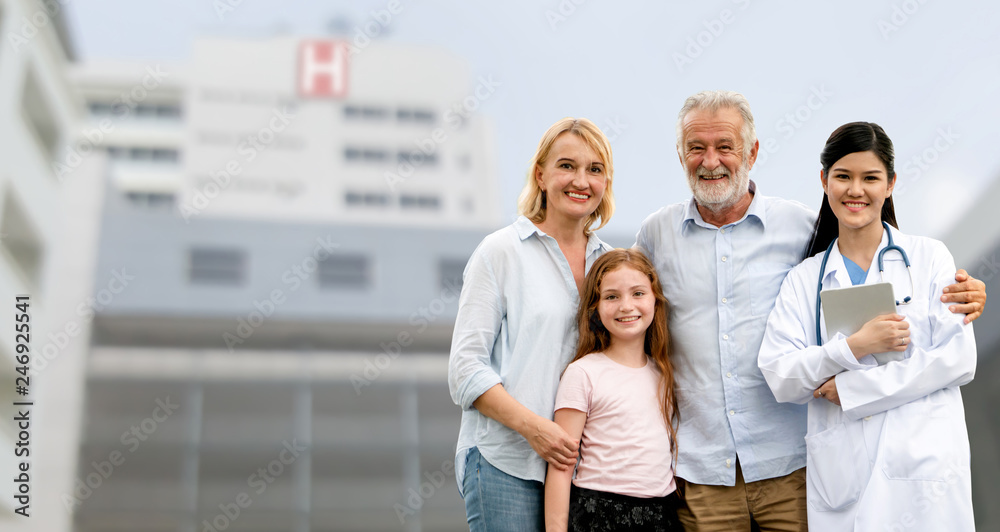 Doctor with happy family of mother, father and daughter at the hospital ...