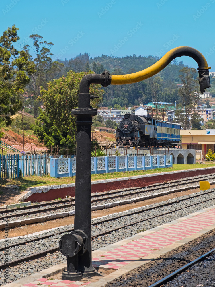 Obsolete steam train and water pump at the railway station at ...