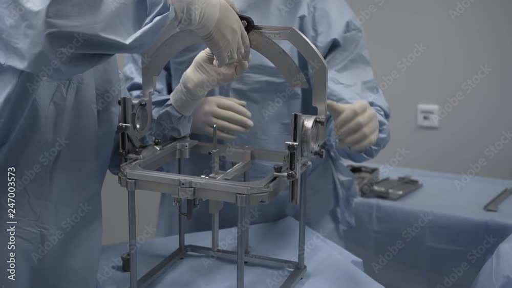 Surgical team prepares medical equipment for complex operation. Steel ...