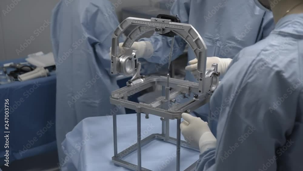 Surgical team prepares medical equipment for complex operation. Steel ...