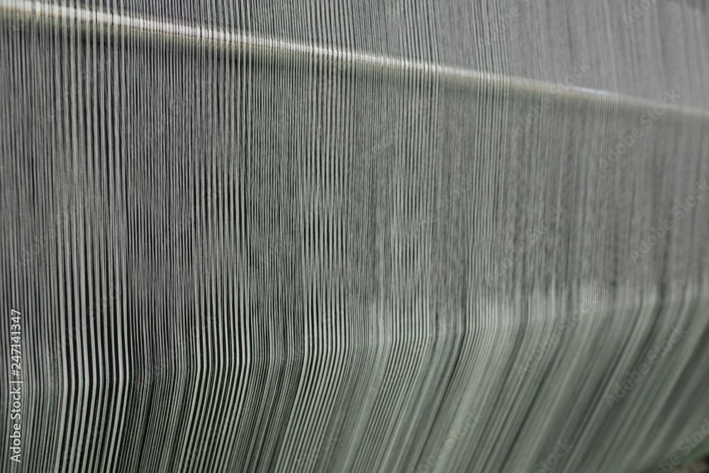 Yarn thread lines on the weaving loom machine. A loom machine for ...