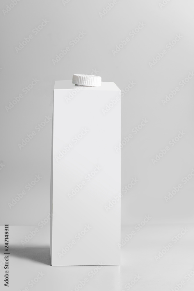 White packaging pack standing on light gray background, front view ...