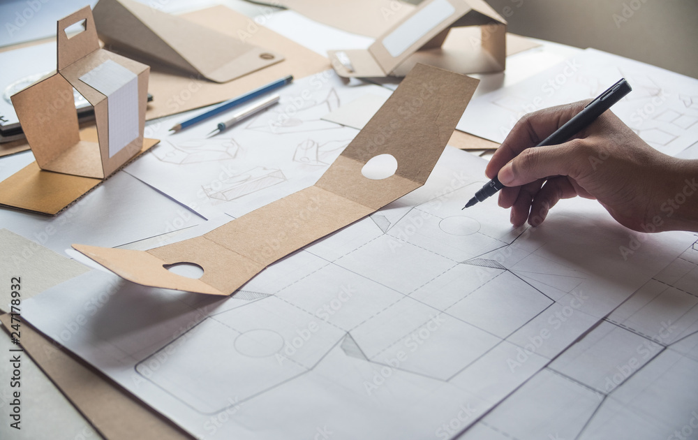 Designer sketching drawing design Brown craft cardboard paper product ...