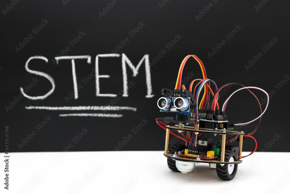 Hand made robot working on the arduino platform. White background. Free ...