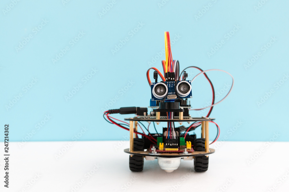 Hand made robot working on the arduino platform. White background. Free ...