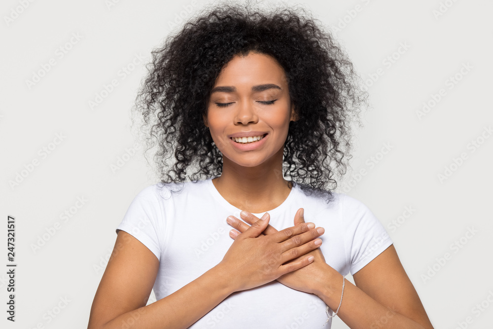Grateful Hopeful Happy Black Woman Holding Hands On Chest Feeling